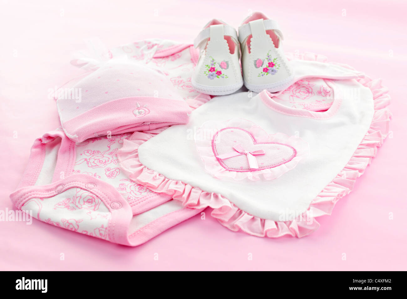 Pink infant girl clothing for baby shower Stock Photo - Alamy