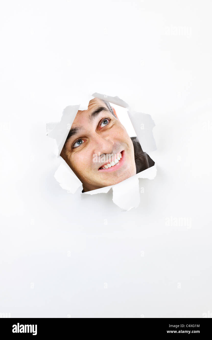 Person Coming Out Of Ripped Paper