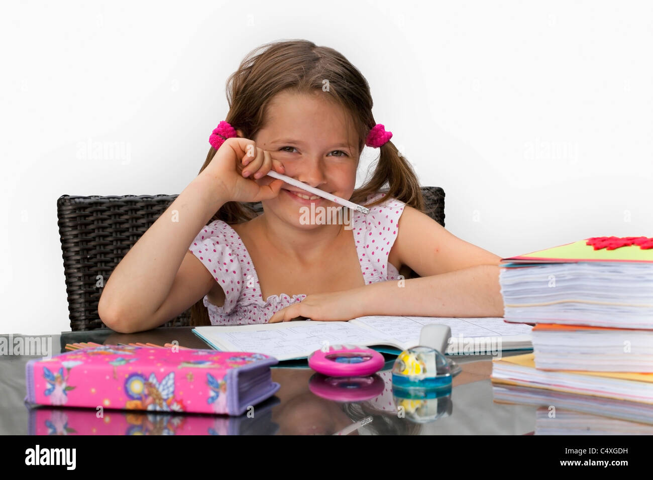 7 year old girl at the table with homework Stock Photo - Alamy