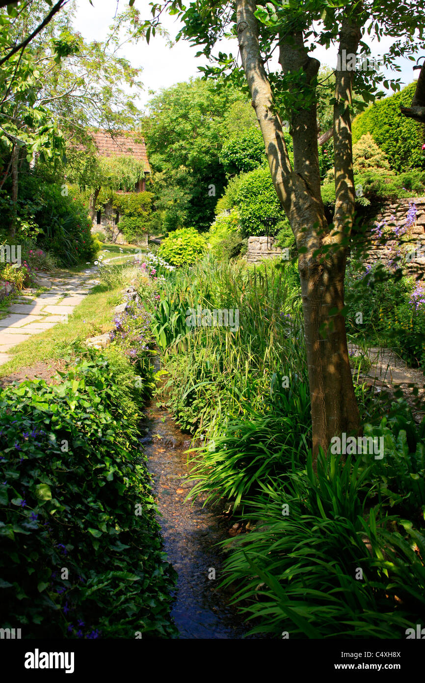 Fresh water stream running through the small village of Sutton Poyntz ...