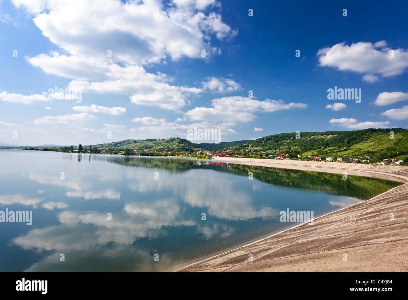 Landscape with a dam lake and a barrage with hills in background Stock ...