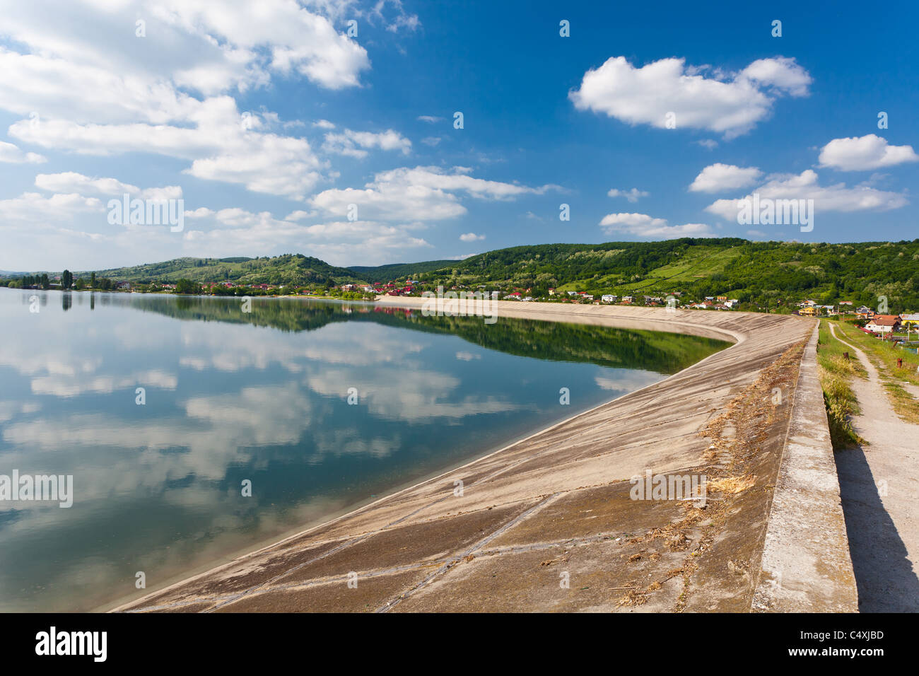 Landscape with a dam lake and a barrage with hills in background Stock ...