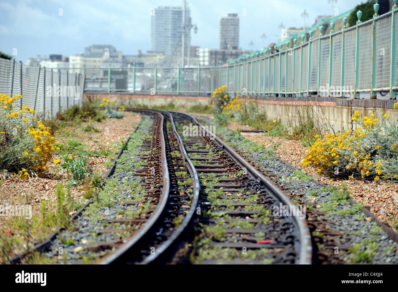 Empty rail tracks for the Volks Railway running along Brighton seafront ...