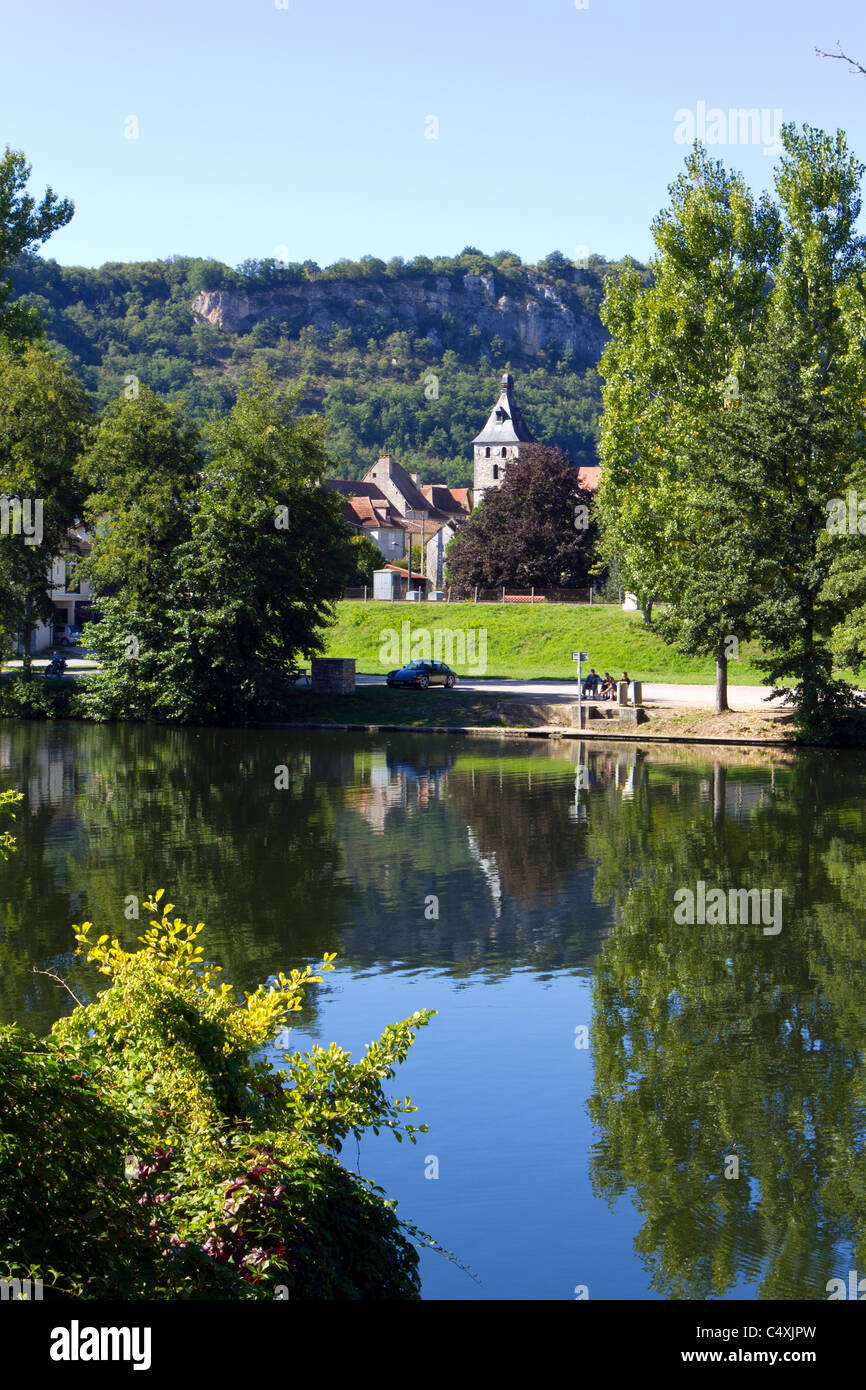 Locals gather by the river for a chat in the autumn sunshine at Cajarc ...