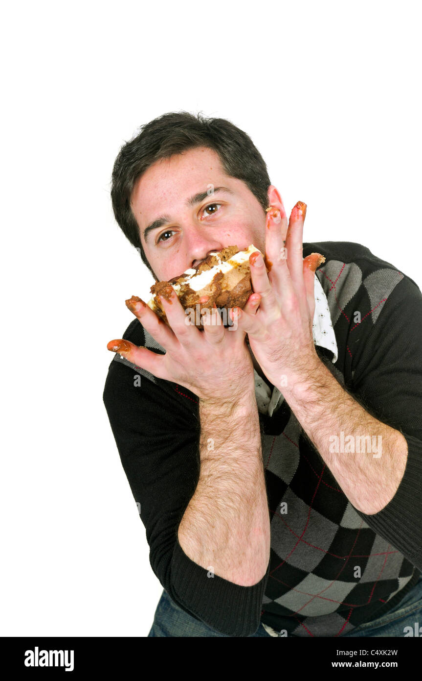 Man indulges in a cream cake Stock Photo - Alamy