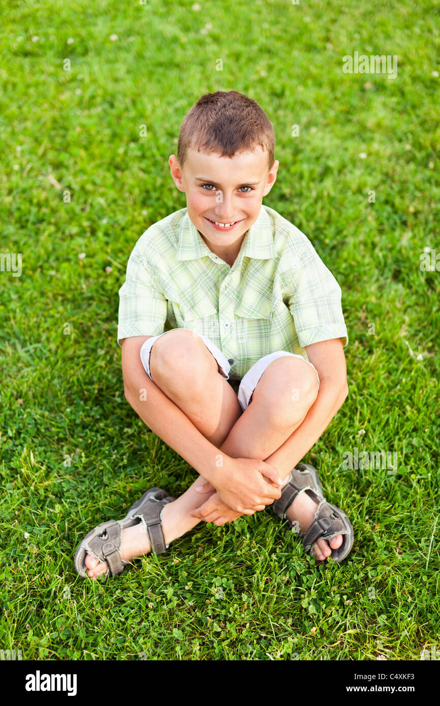 Portrait of a happy boy outdoor in a park Stock Photo - Alamy