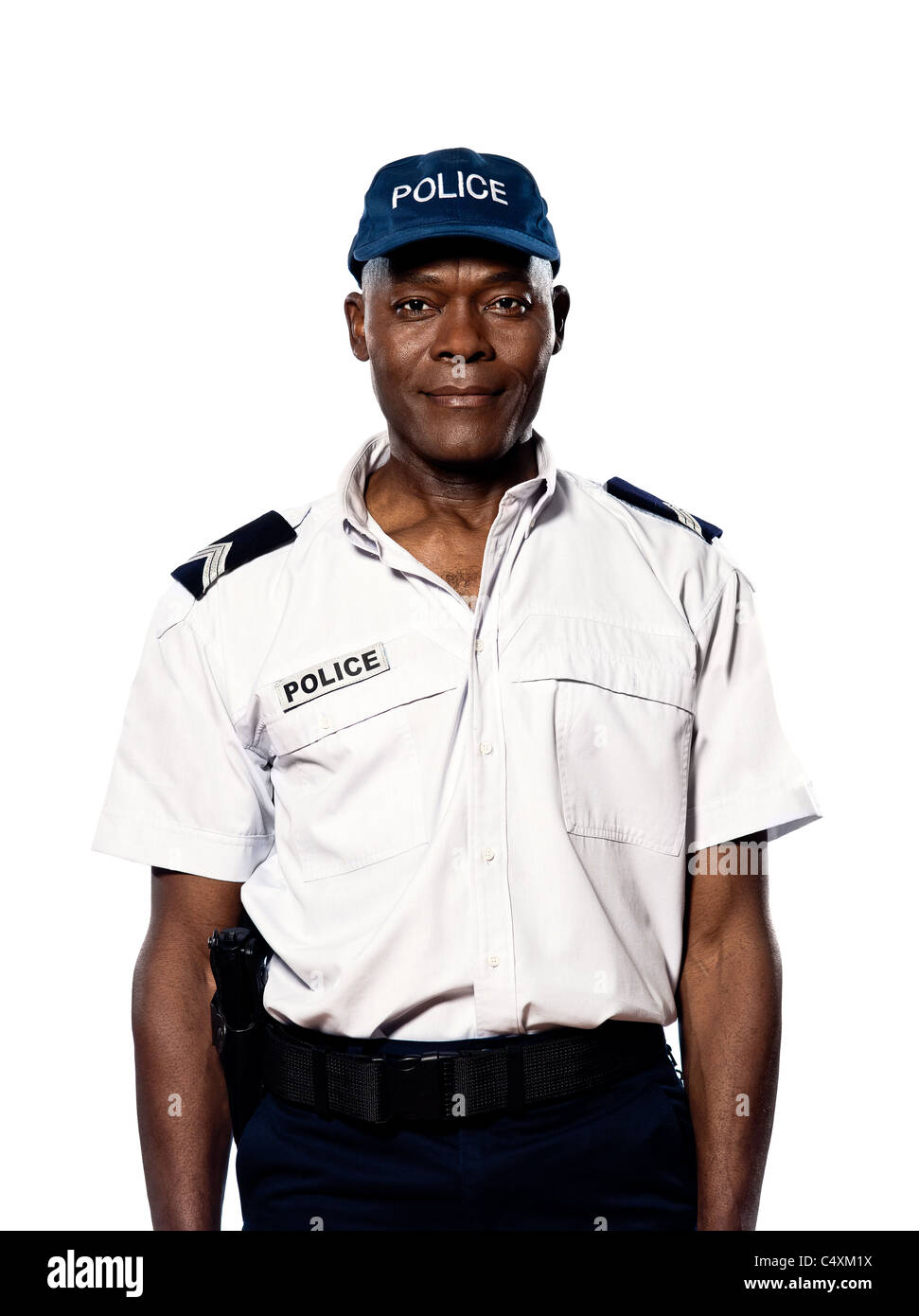 Portrait of an afro American mature police officer standing in studio ...