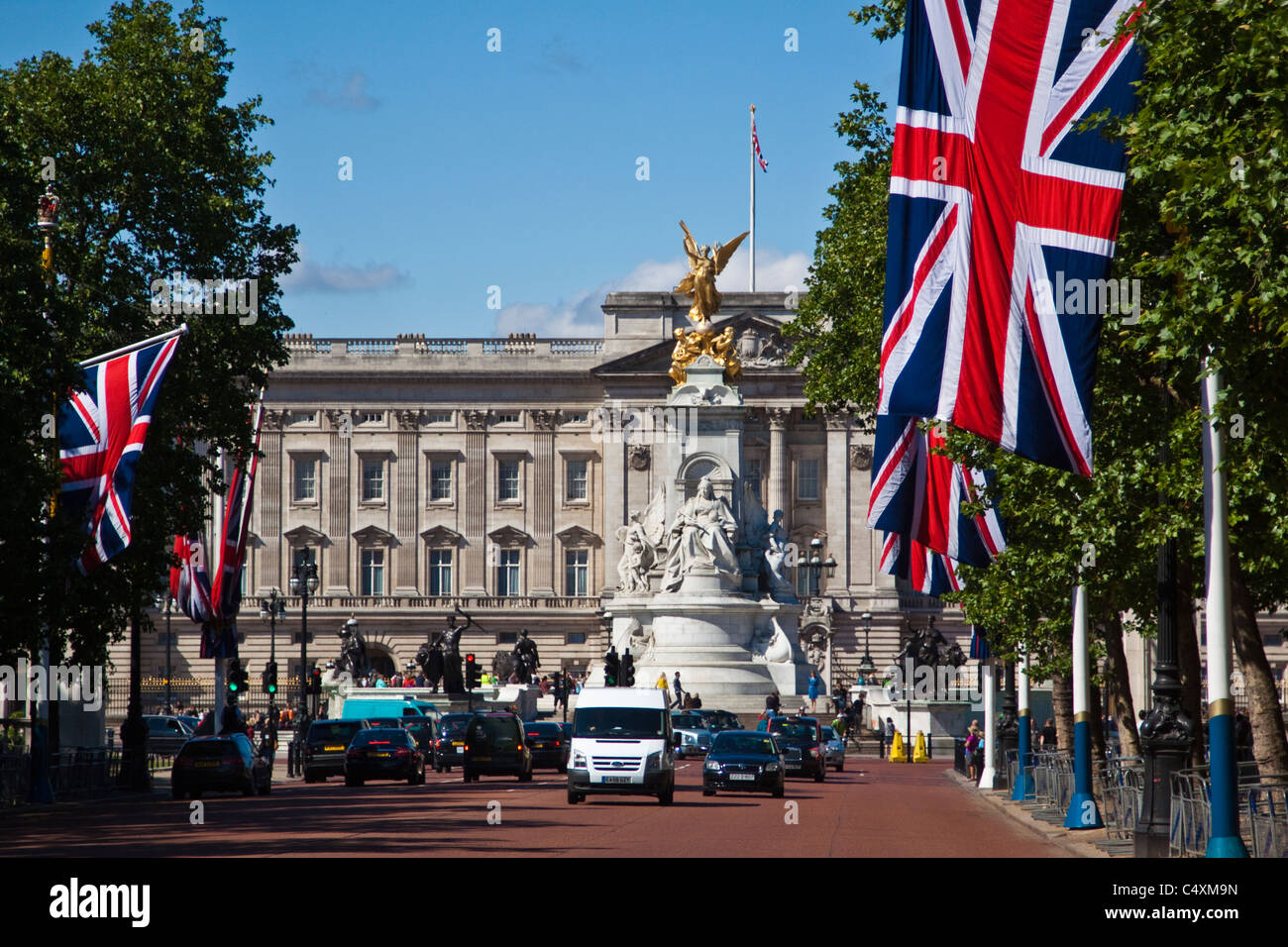Queen Victoria memorial in front of Buckingham palace with Union flags ...
