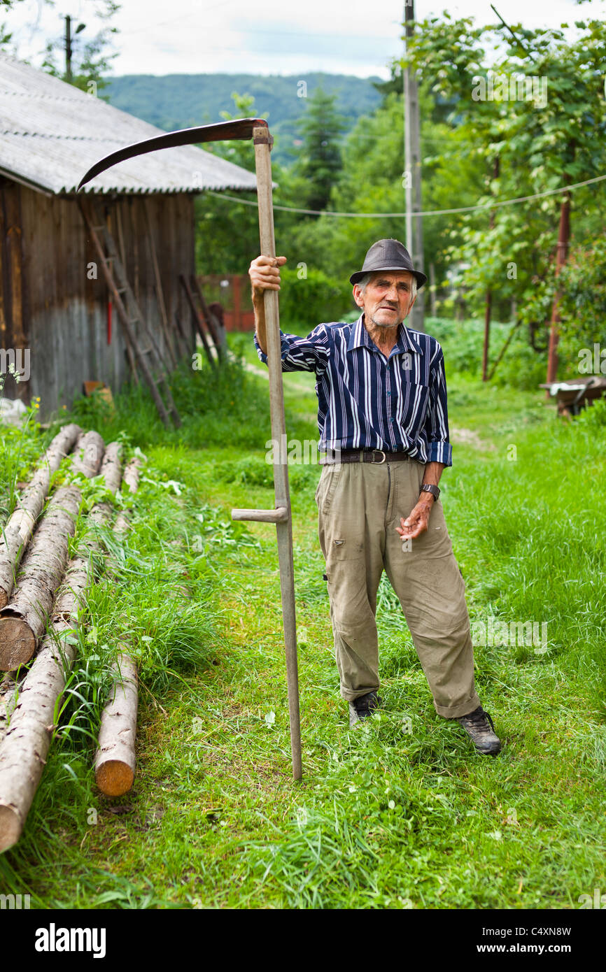 Farmer using scythe hi-res stock photography and images - Alamy