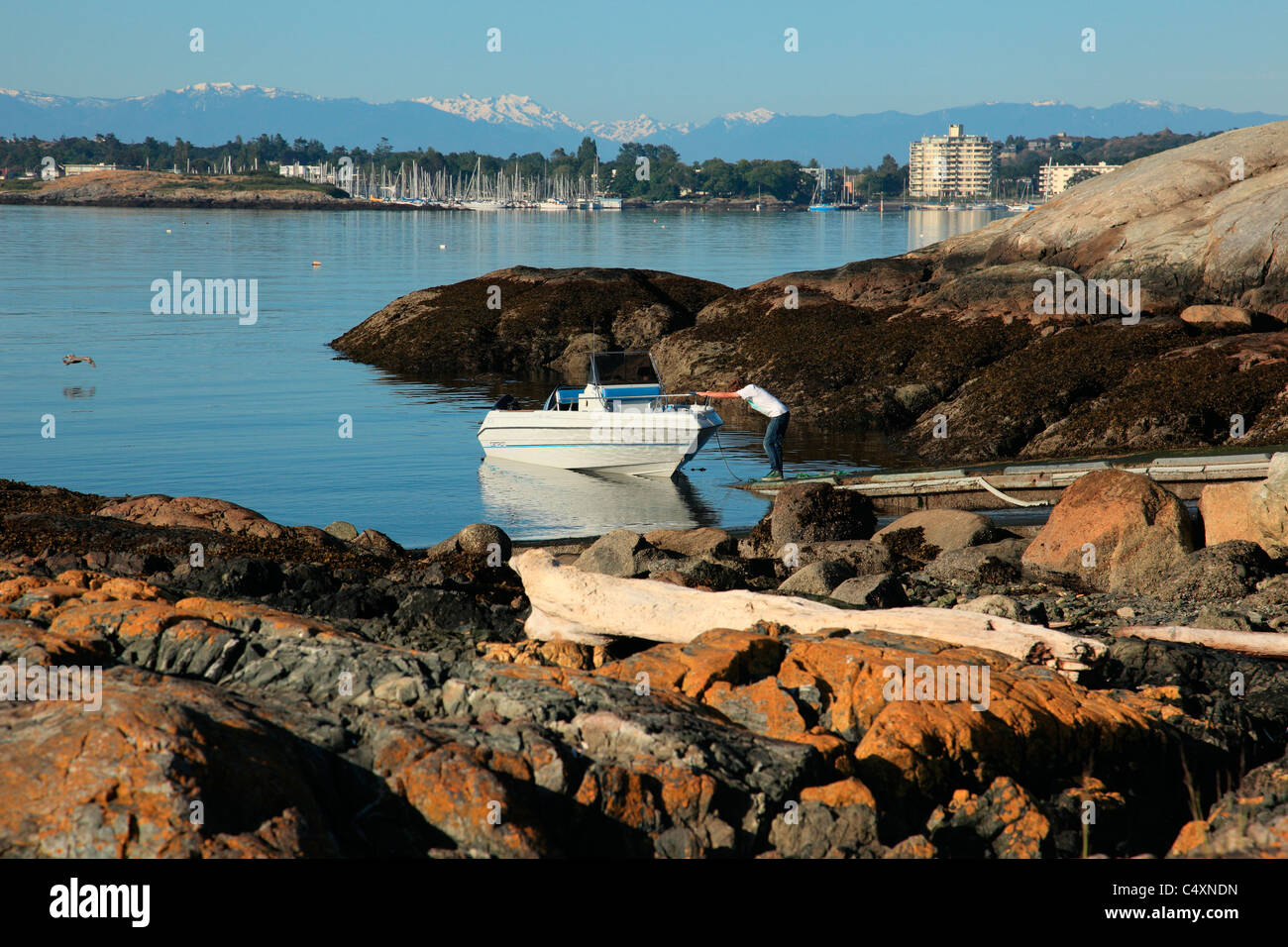 fishing boat launching to go fishing on a calm summer morning in ...
