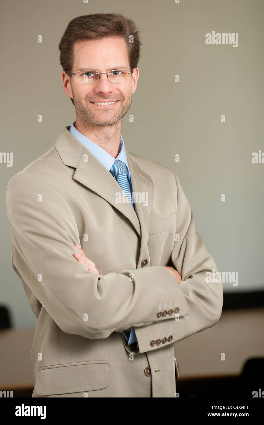 Middle aged and successful businessman in his office Stock Photo - Alamy
