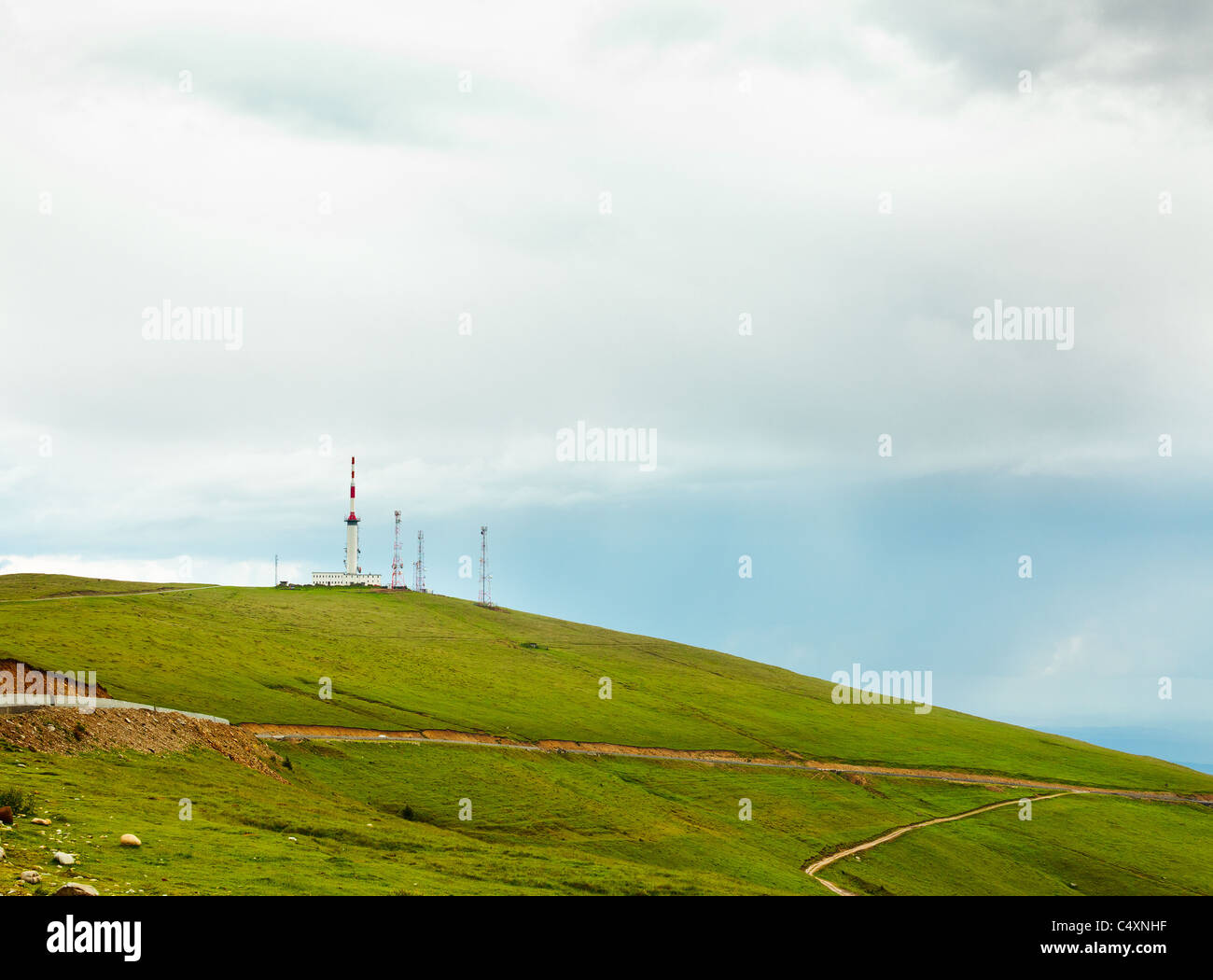 Landscape with mountains and a big telecommunications pole Stock Photo ...