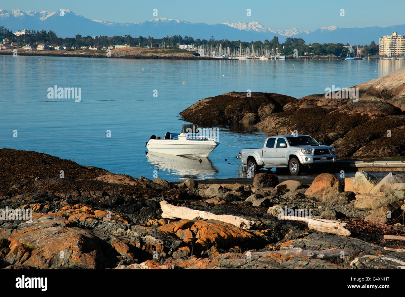fishing boat launching to go fishing on a calm summer morning in ...
