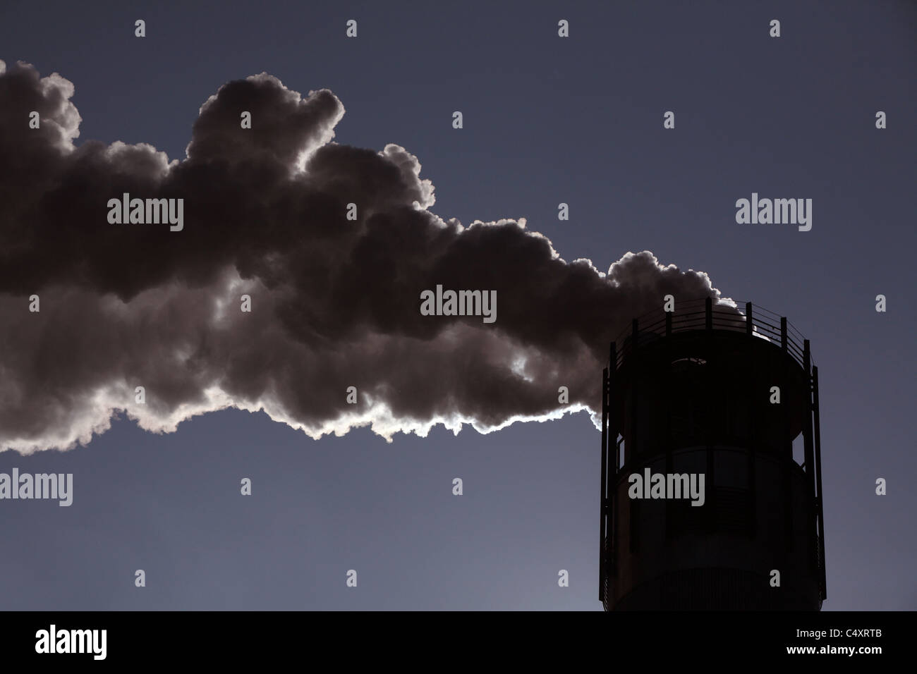 A smoking factory chimney Stock Photo - Alamy