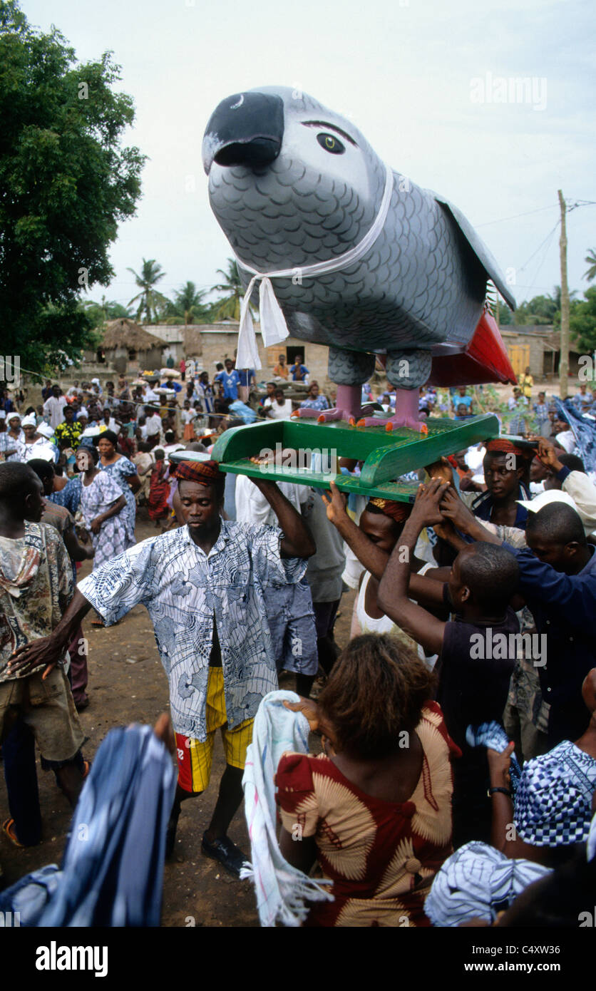 Novelty Coffin shaped like a parrot being carried a procession to the ...