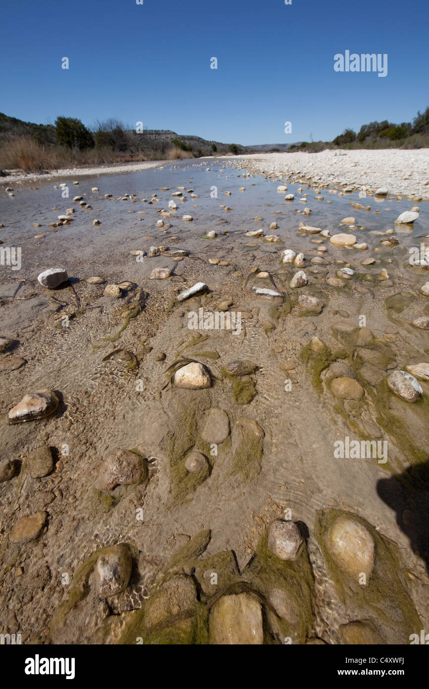 Rocks under the surface of a shallow part of spring-fed Independence ...