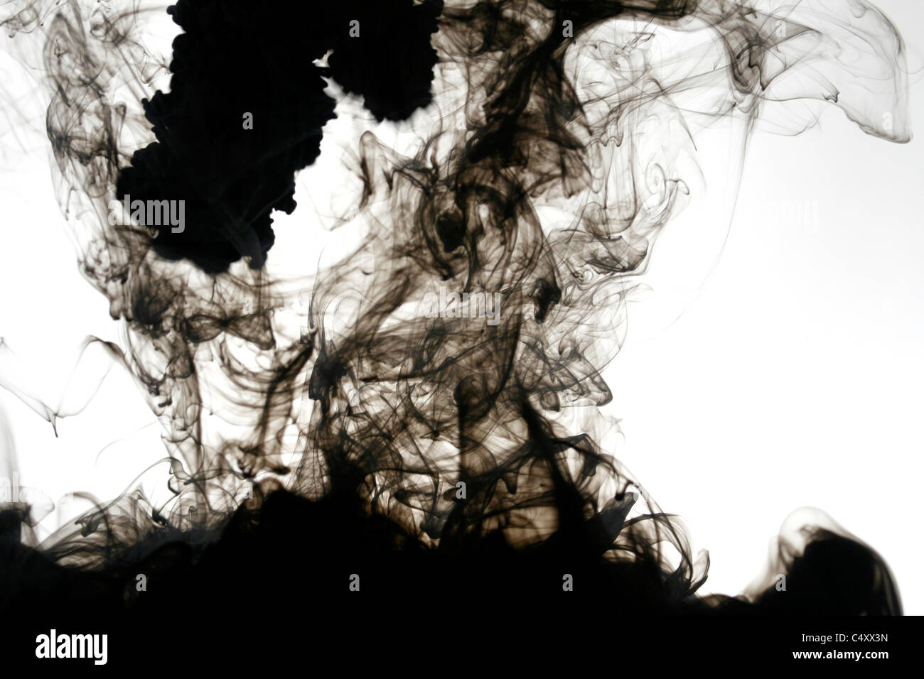 Smoke liquid ink in water Stock Photo - Alamy