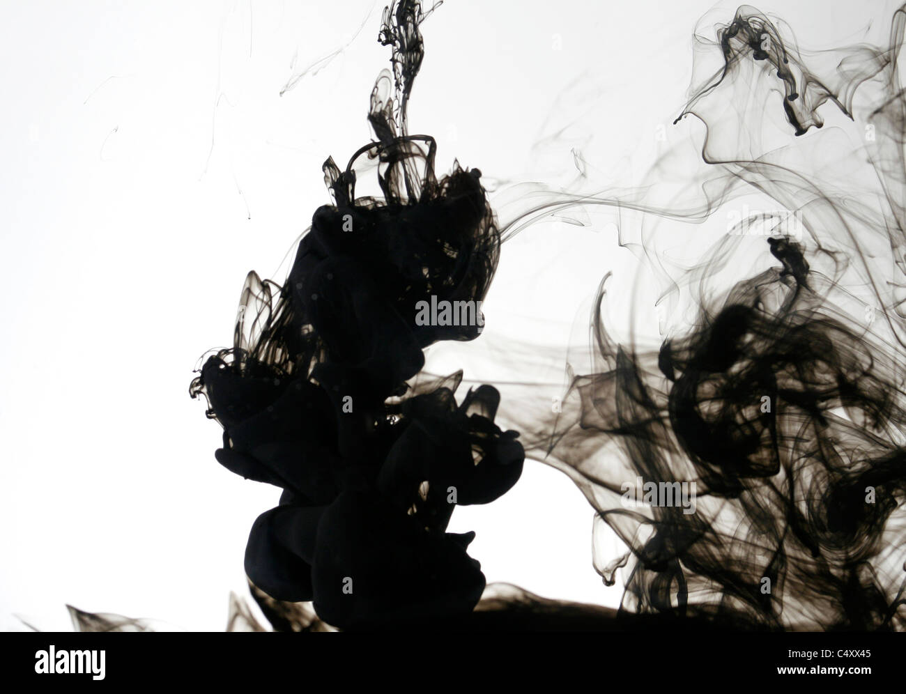Smoke liquid ink in water Stock Photo - Alamy