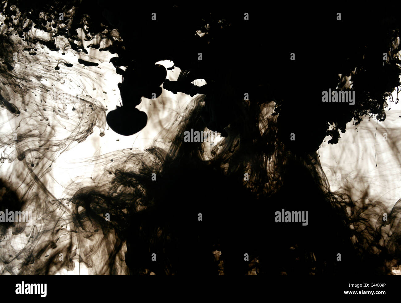 Smoke liquid ink in water Stock Photo - Alamy