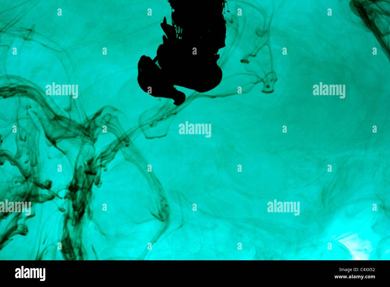 Smoke liquid ink in water Stock Photo - Alamy