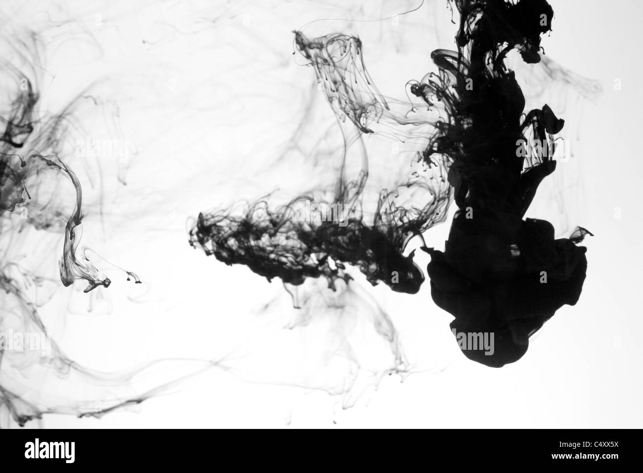 Smoke liquid ink in water Stock Photo - Alamy