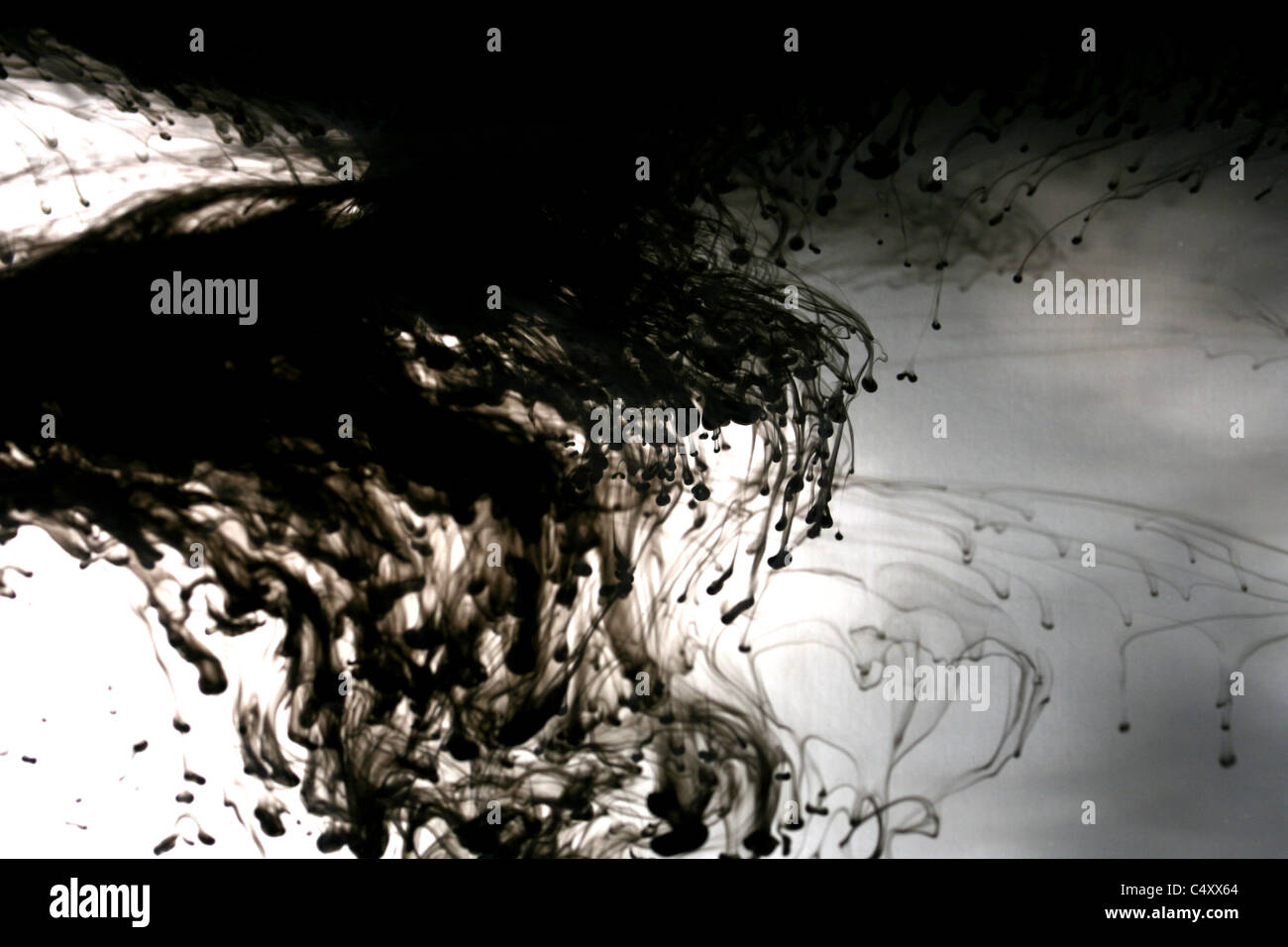 Smoke liquid ink in water Stock Photo - Alamy