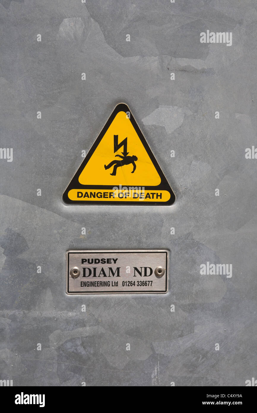 Danger of death by electrocution metallic warning Stock Photo - Alamy