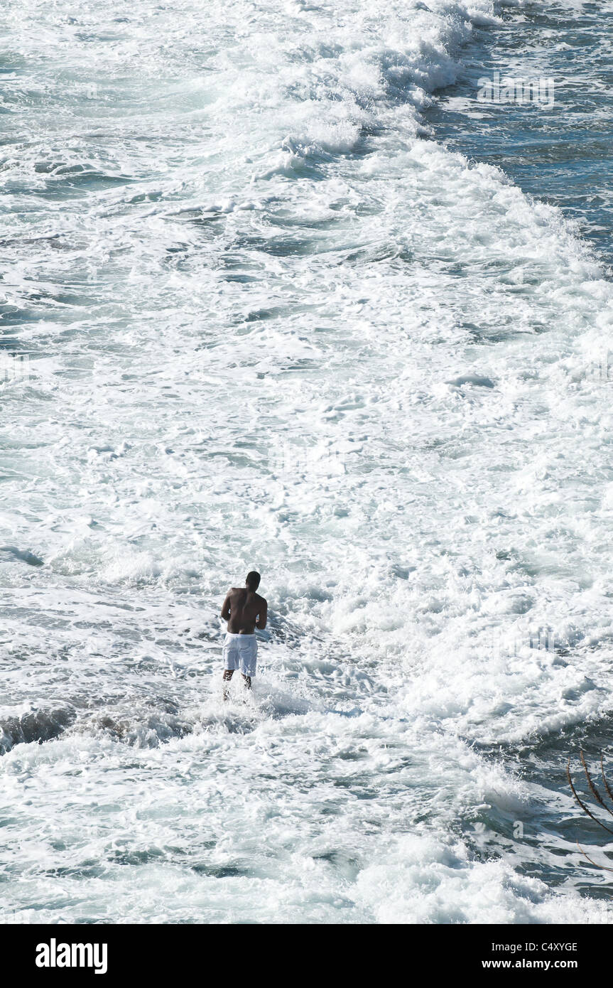 Fisherman on rock Biabou, St. Vincent & The Grenadines Stock Photo - Alamy