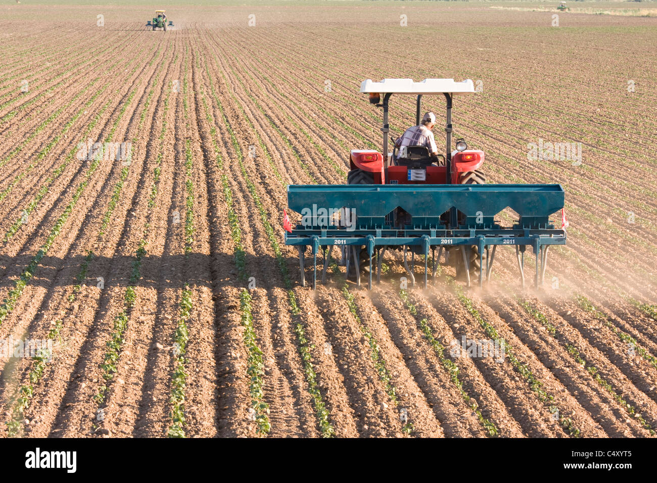 Farmer with tractor Stock Photo - Alamy