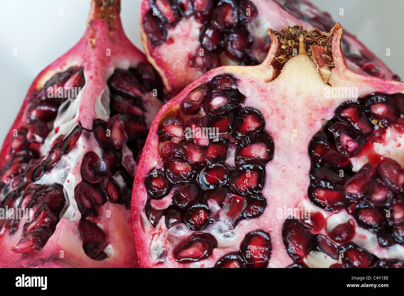 Food: A pomegranate fruit cut into sections Stock Photo - Alamy