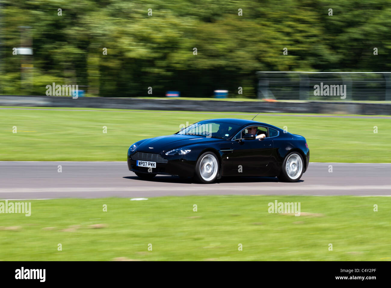 An Aston Martin DB9 driving on Castle Combe Circuit Stock Photo - Alamy