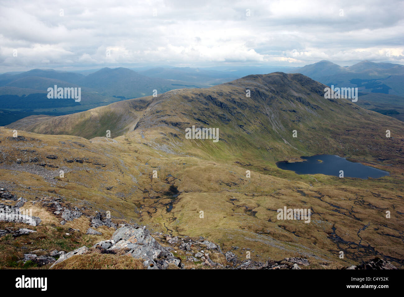 Beinn Dubhcraig from the summit plateau of Ben Oss with Loch Oss on the ...