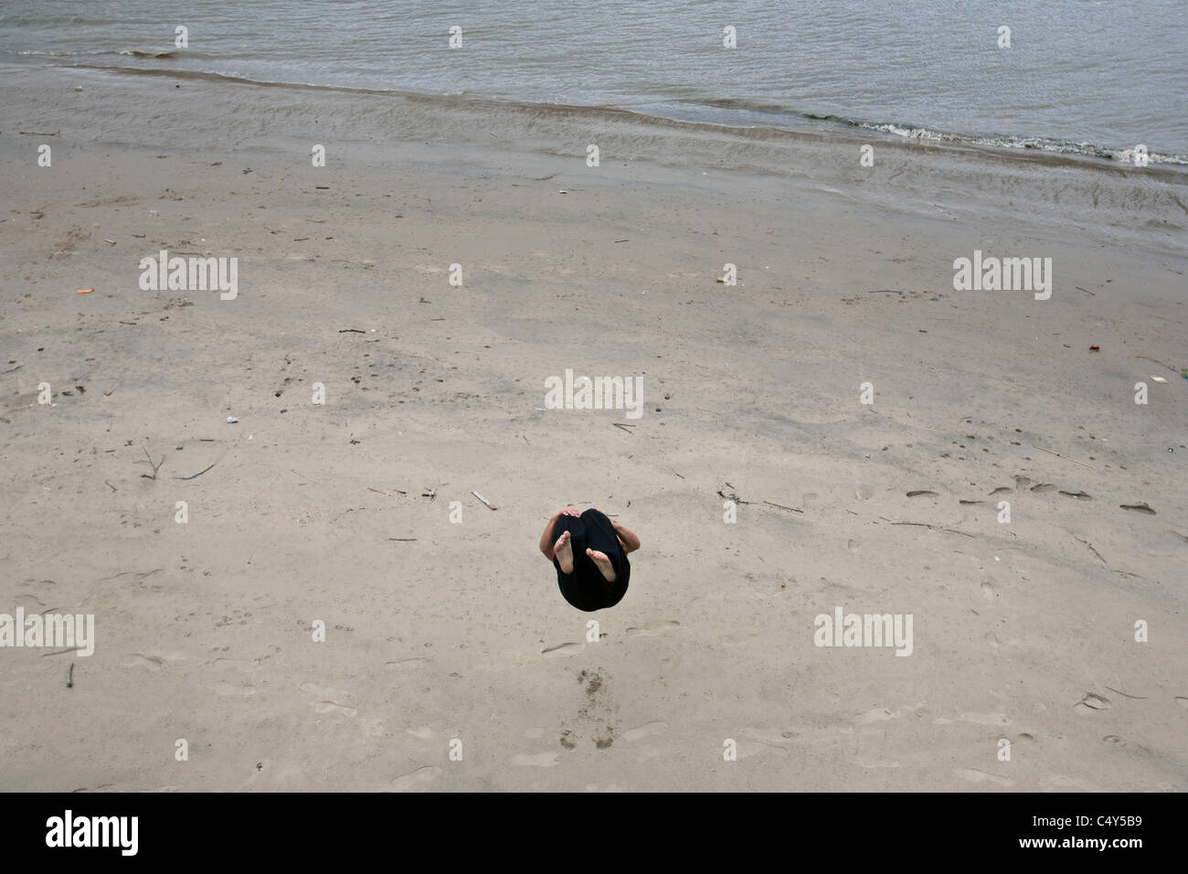 somersault on thames beach in london Stock Photo - Alamy