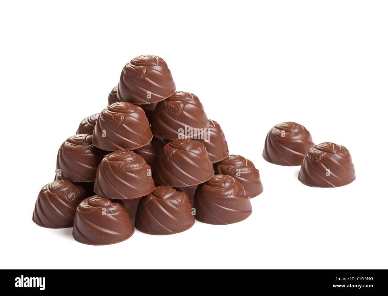 Pile of candies isolated on white Stock Photo - Alamy