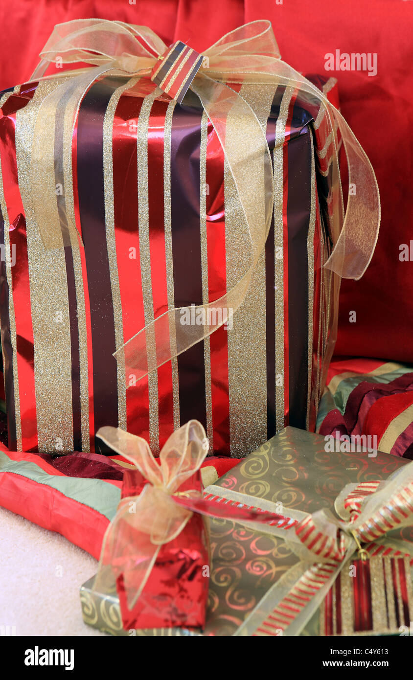 Christmas presents wrapped and with ribbons and bows Stock Photo - Alamy