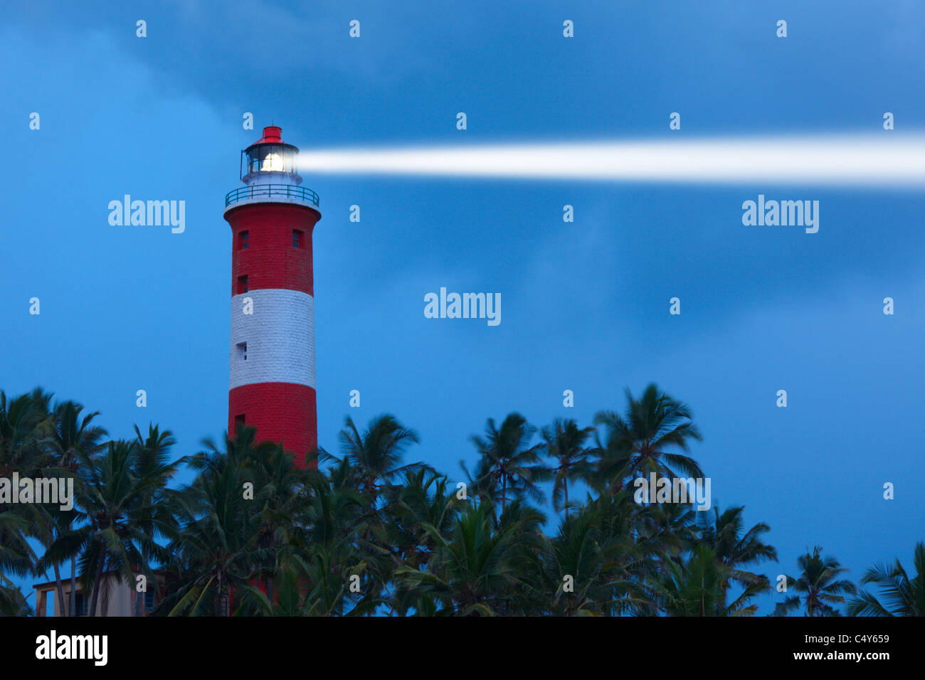 Lighthouse in night with light beam Stock Photo - Alamy