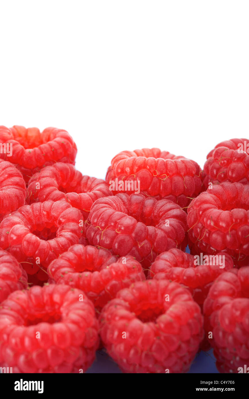 Raspberries on white background Stock Photo - Alamy