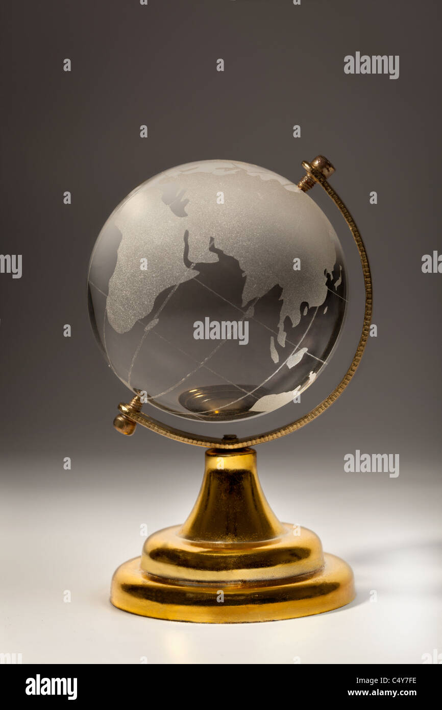Crystal glass globe on gradient gray background Stock Photo - Alamy