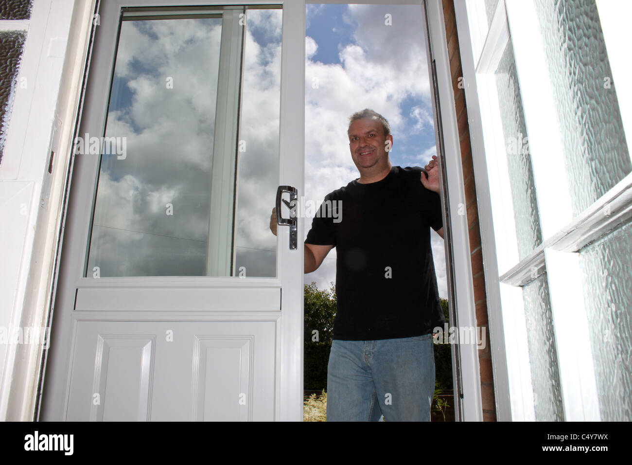 opening and closing new PVC windows and doors Stock Photo - Alamy