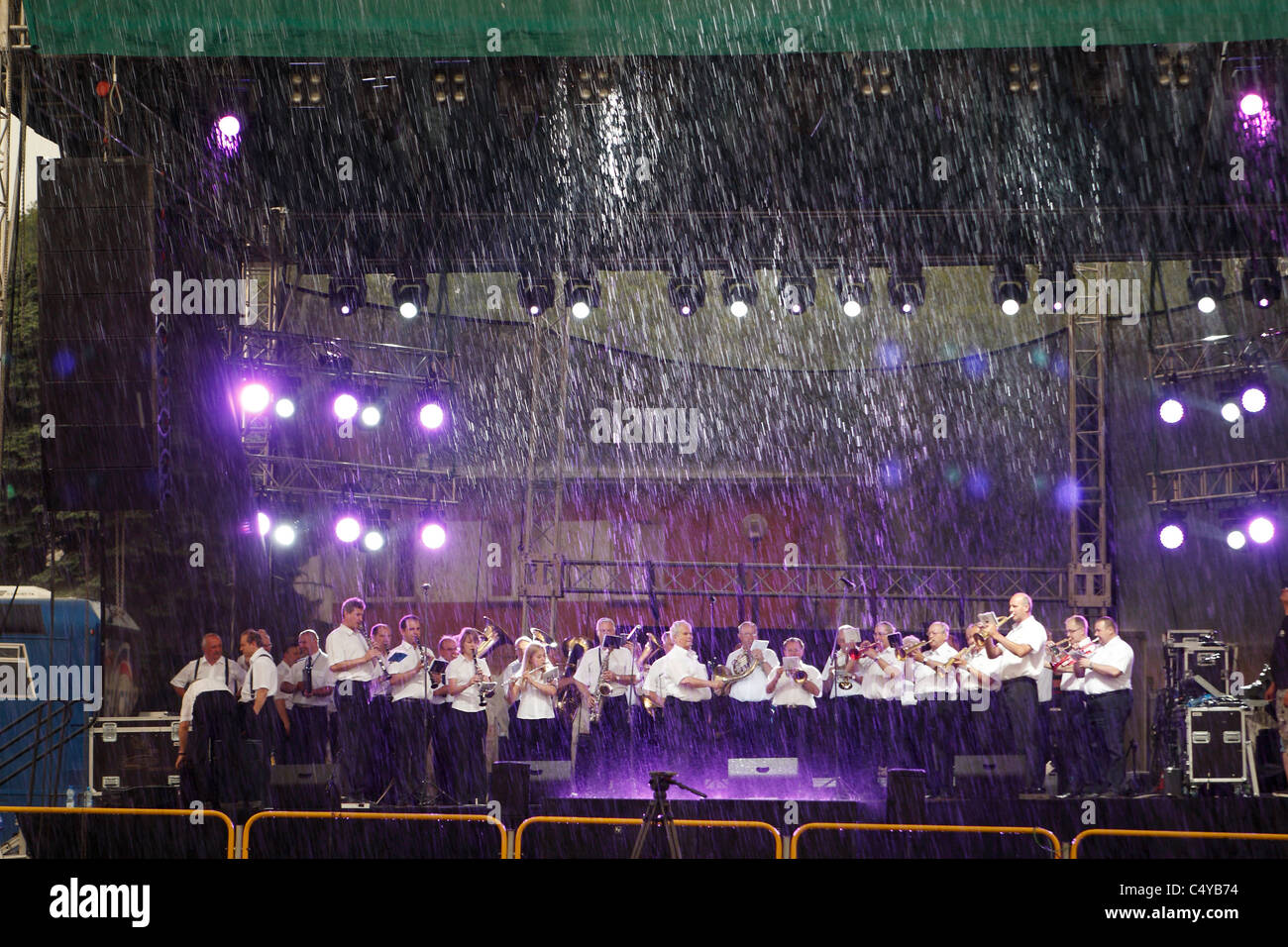 Open air concert by the brass orchestra during heavy rain Stock Photo ...