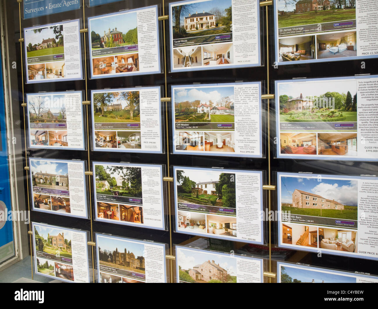 Estate Agent shop window displaying mid to upper market properties in ...