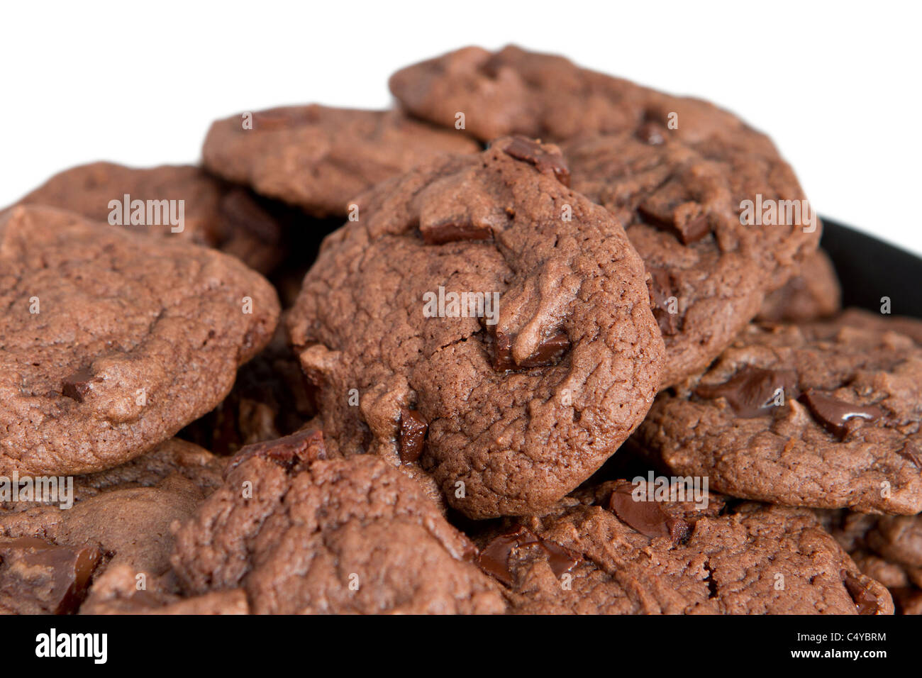pile of chocolate chip cookies isolated over white Stock Photo - Alamy