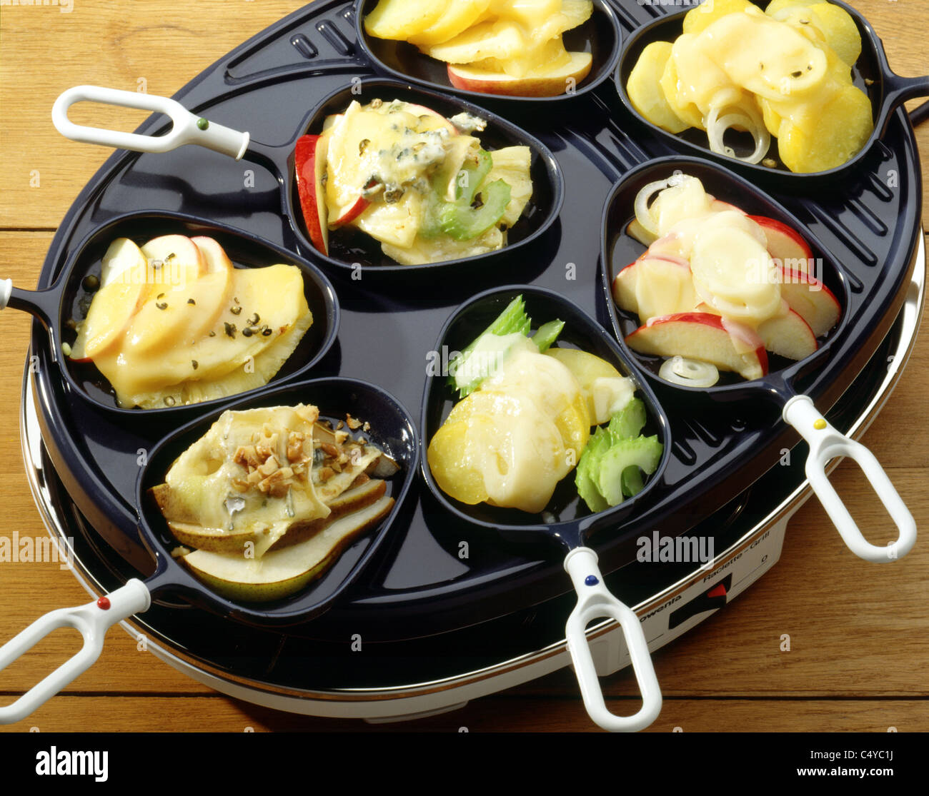 Raclette with vegetables and fruits Stock Photo - Alamy
