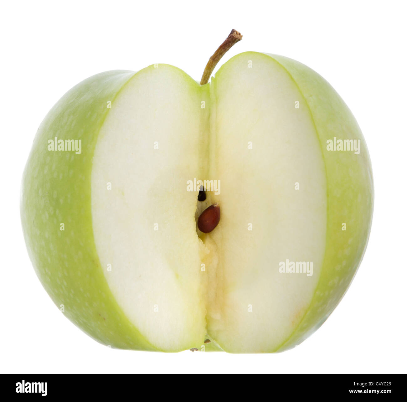 one green apple with a slice removed to see the core Stock Photo - Alamy
