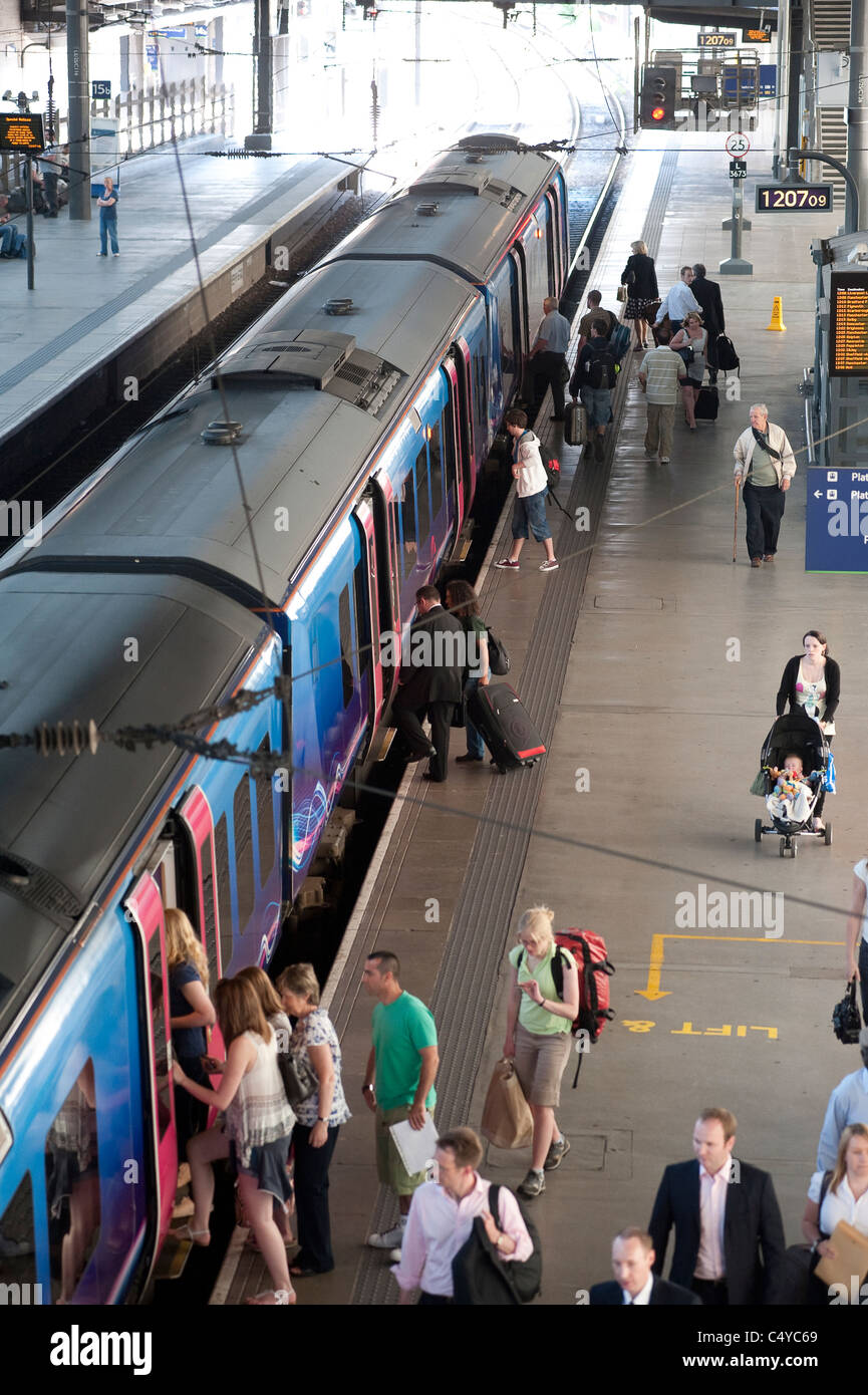 Passengers boarding a First transpennine express train at a railway ...