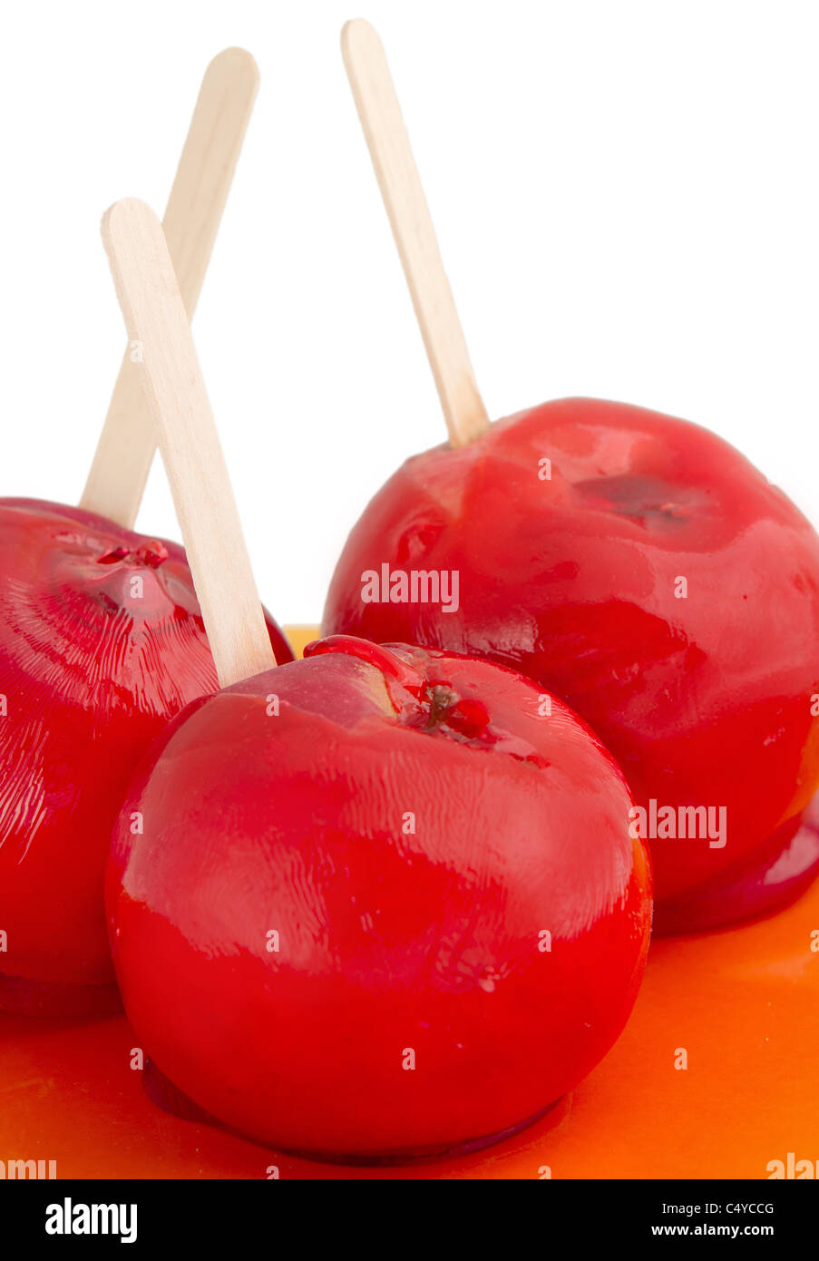 candied apples closeup over white Stock Photo - Alamy
