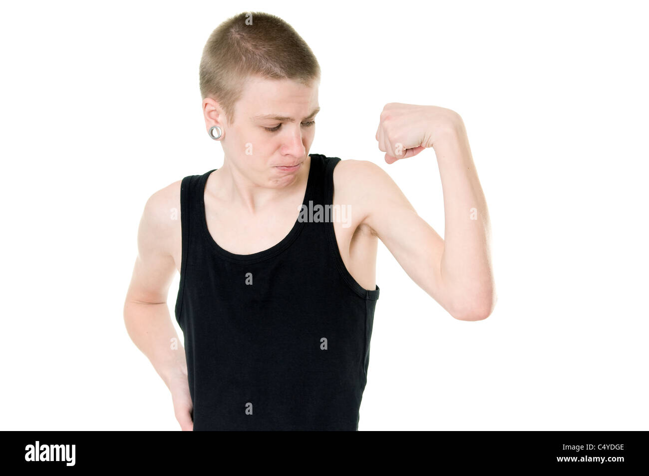 funny skinny teen shows biceps isolated on white background Stock Photo ...