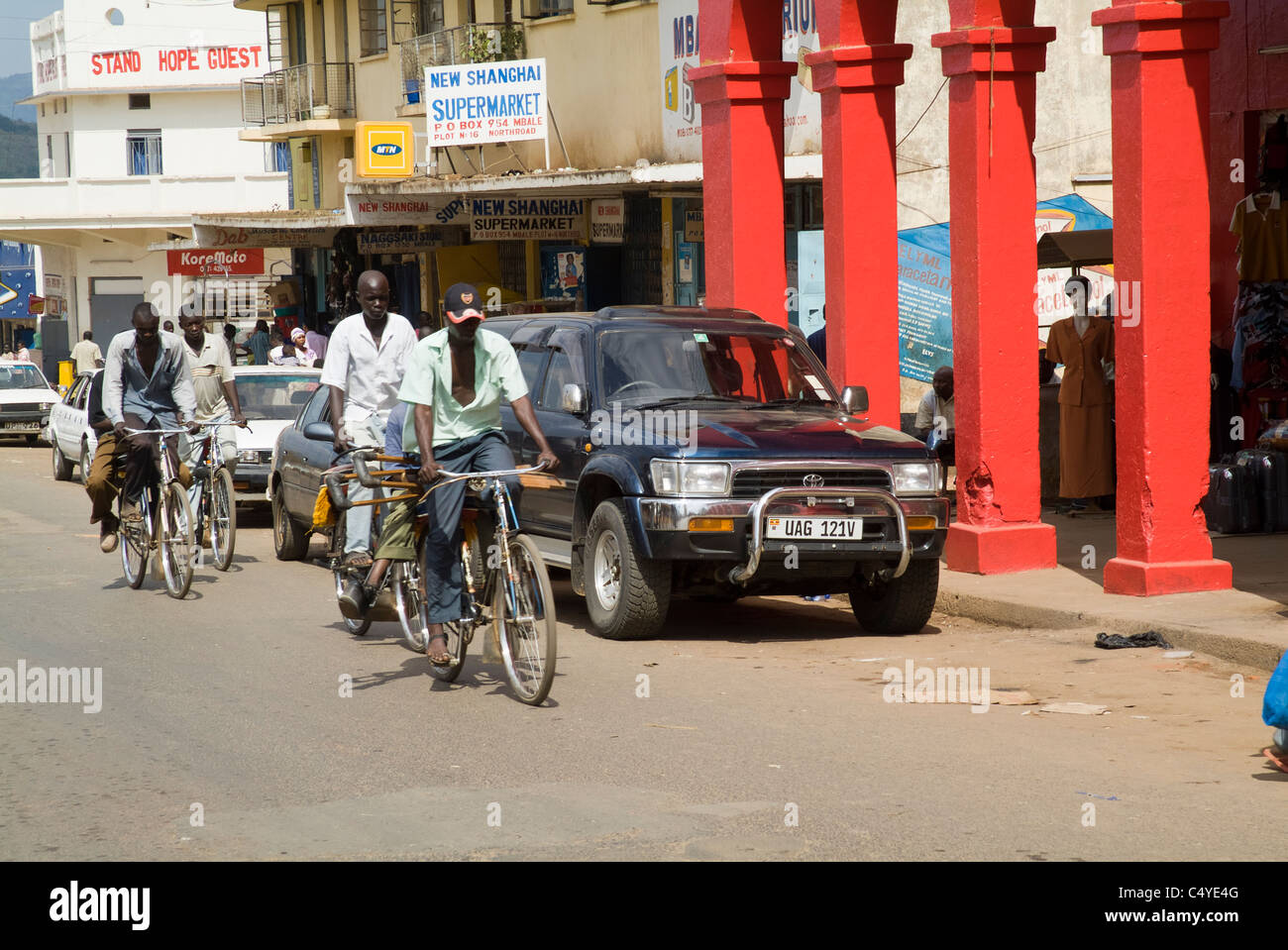 Umbale, Eastern Uganda, Africa, men riding bicycles Stock Photo - Alamy