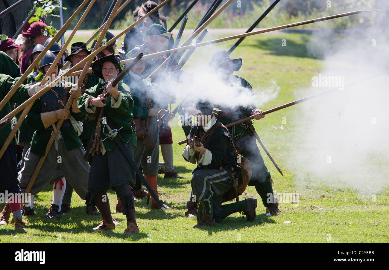 Members of the English Civil War Society clash during a battle re ...