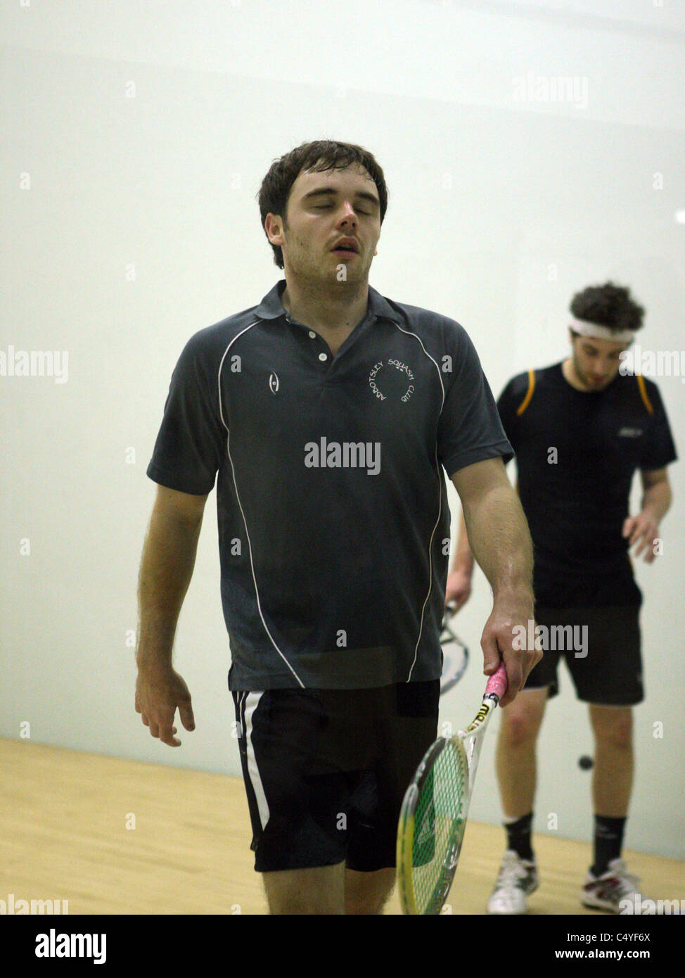 Squash Player under pressure Stock Photo - Alamy